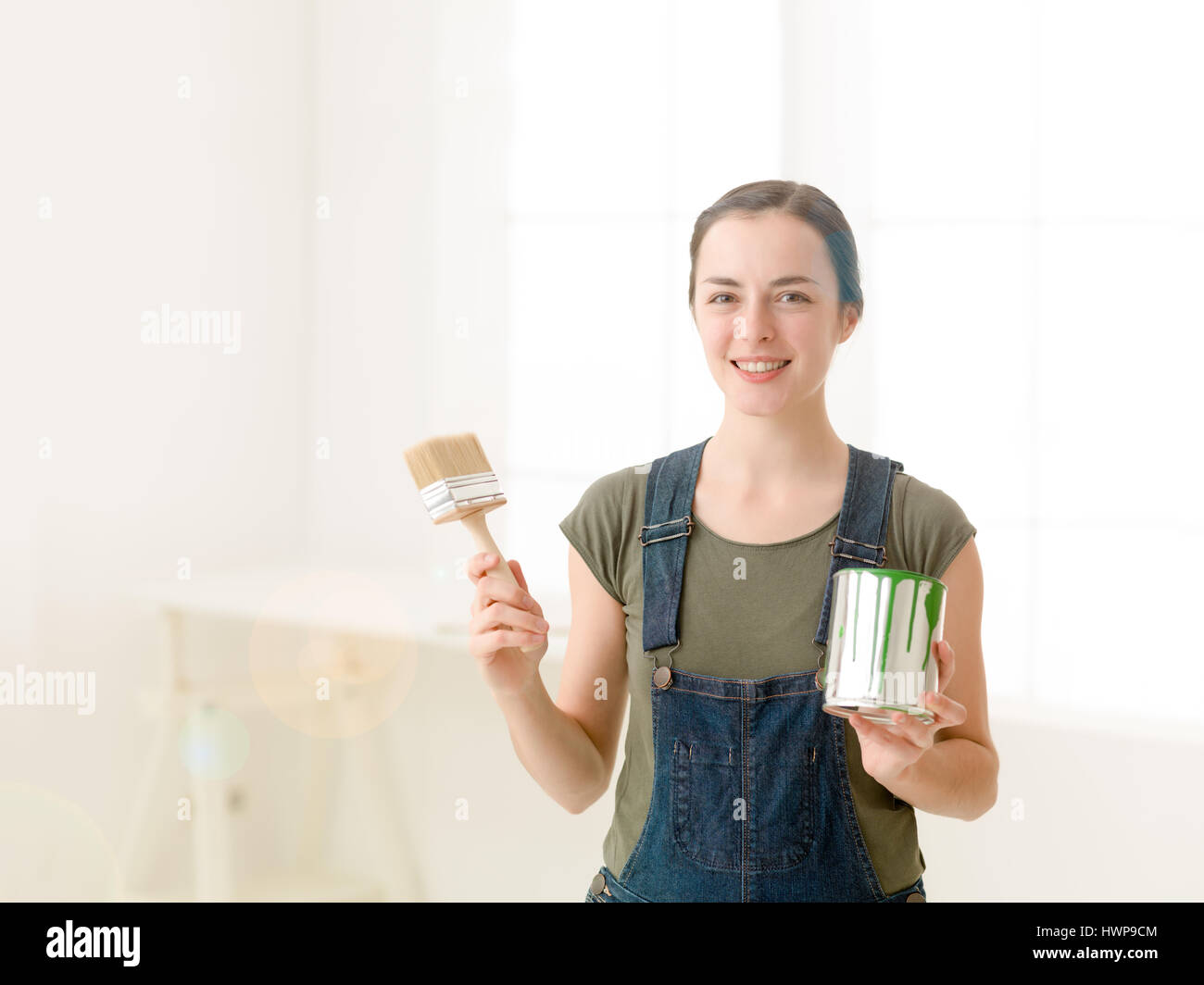 Woman smiling painting Stock Photo - Alamy