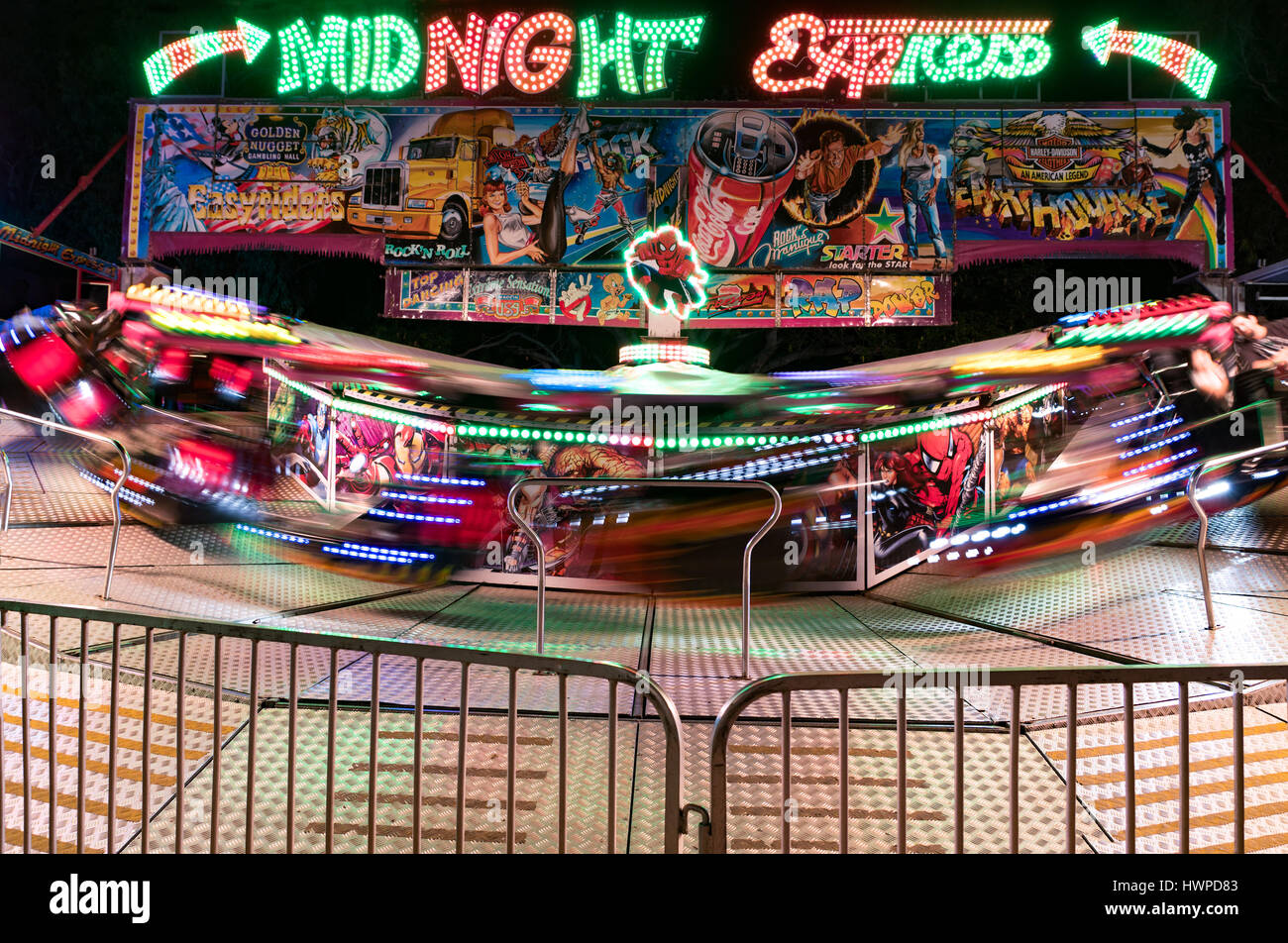 A colourful carnival ride, Midnight Express, going at high speed at the ...
