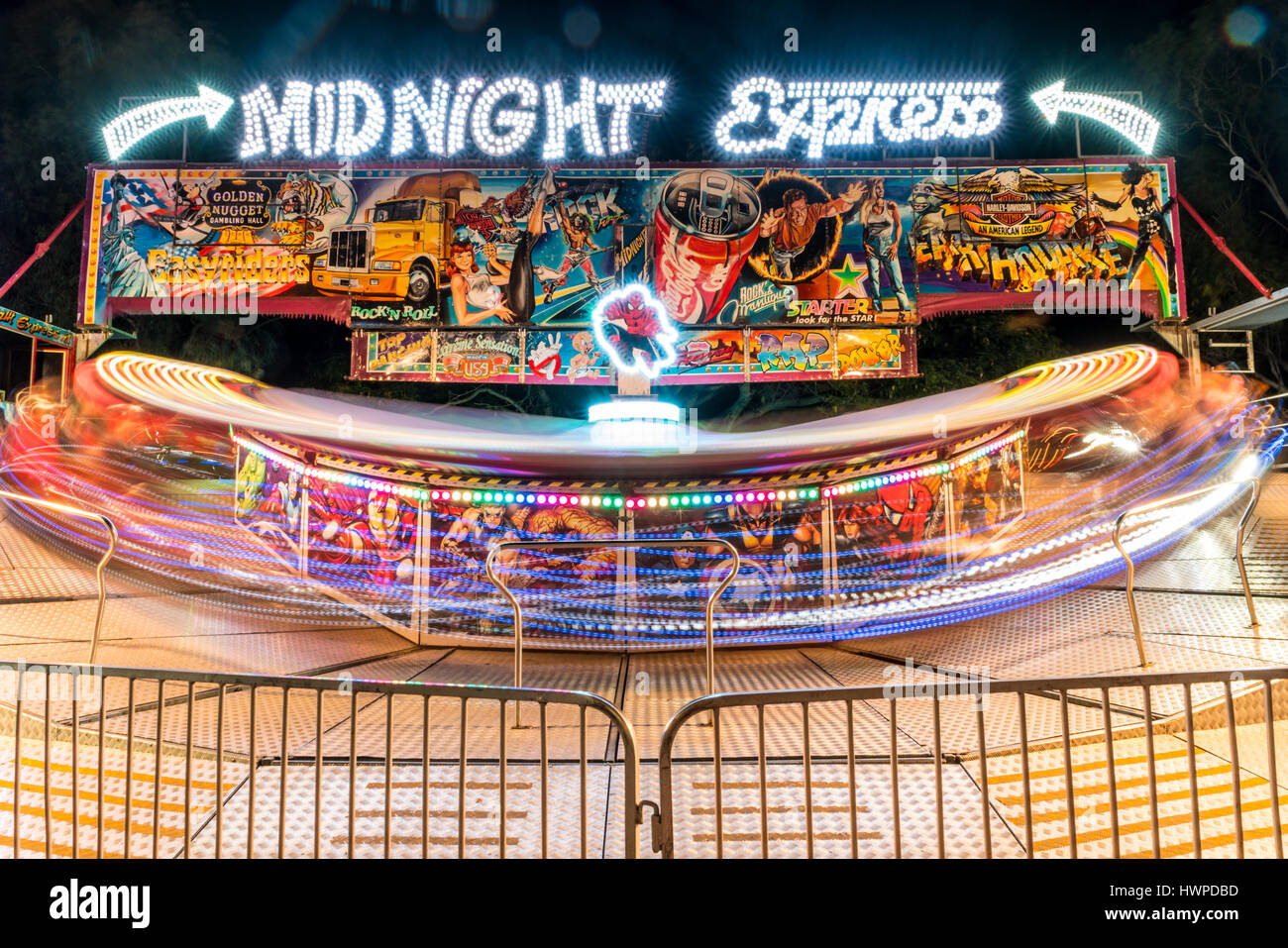 A colourful carnival ride, Midnight Express, going at high speed at the ...