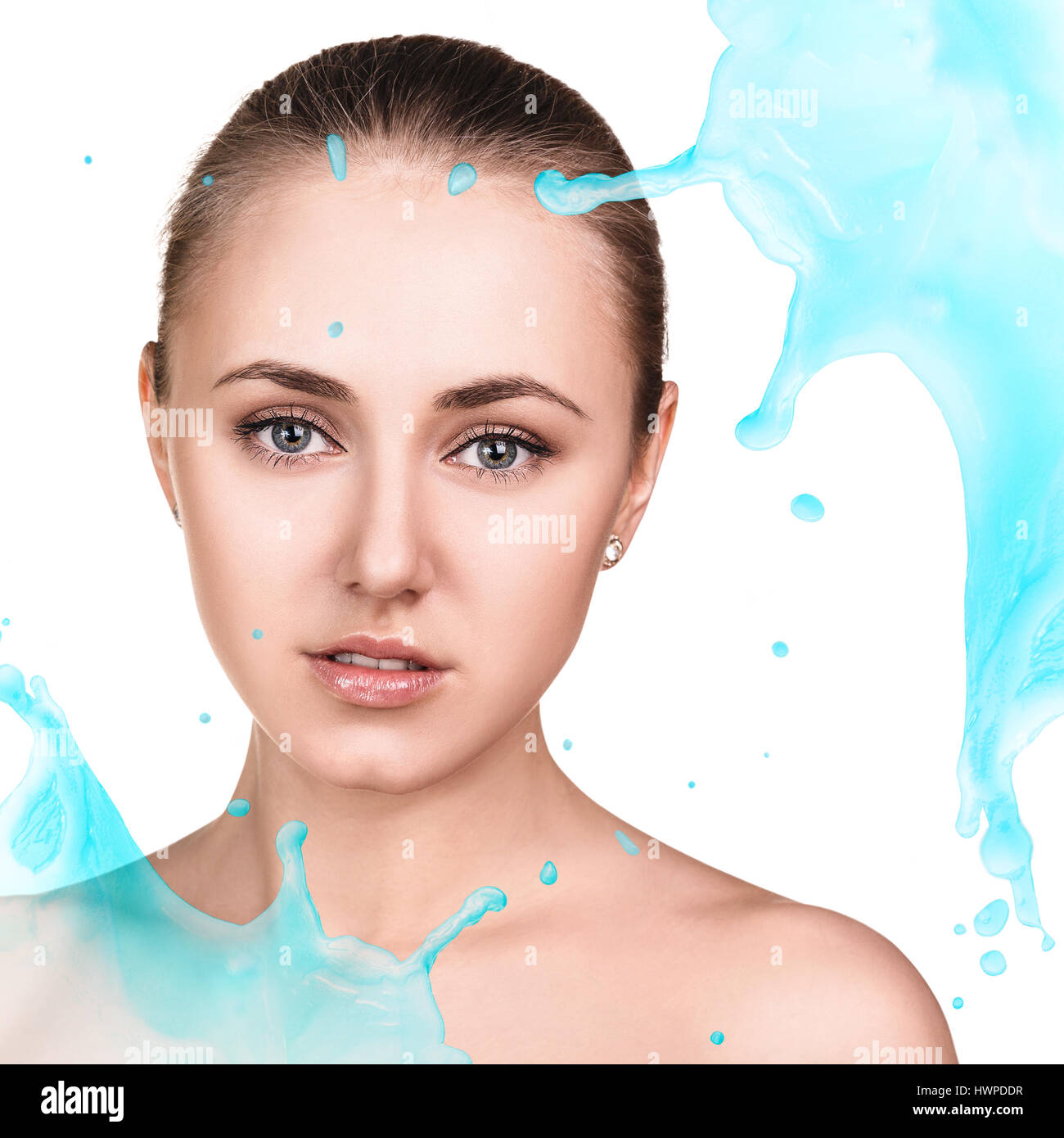 Young woman face in splashes of water over white background. Moistening ...