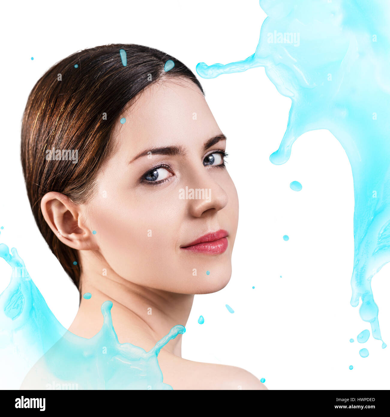 Young woman face in splashes of water over white background. Moistening ...