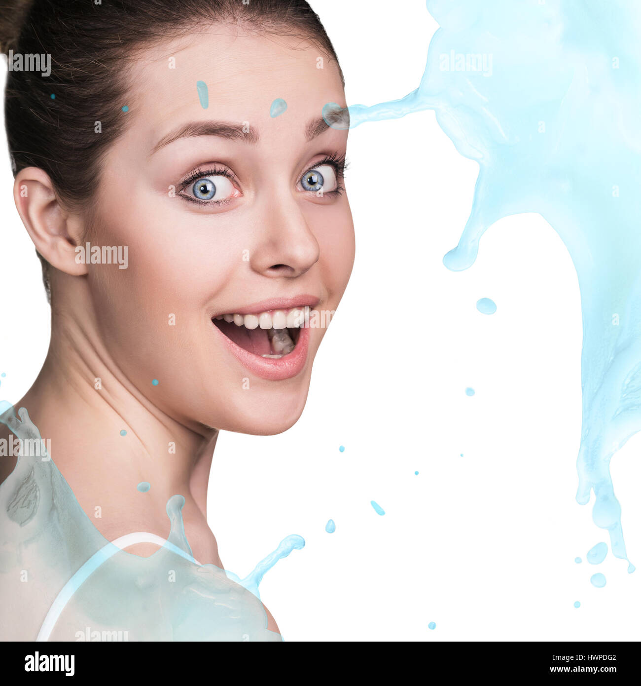 Splashes of water near beautiful face of young woman. Moistening ...