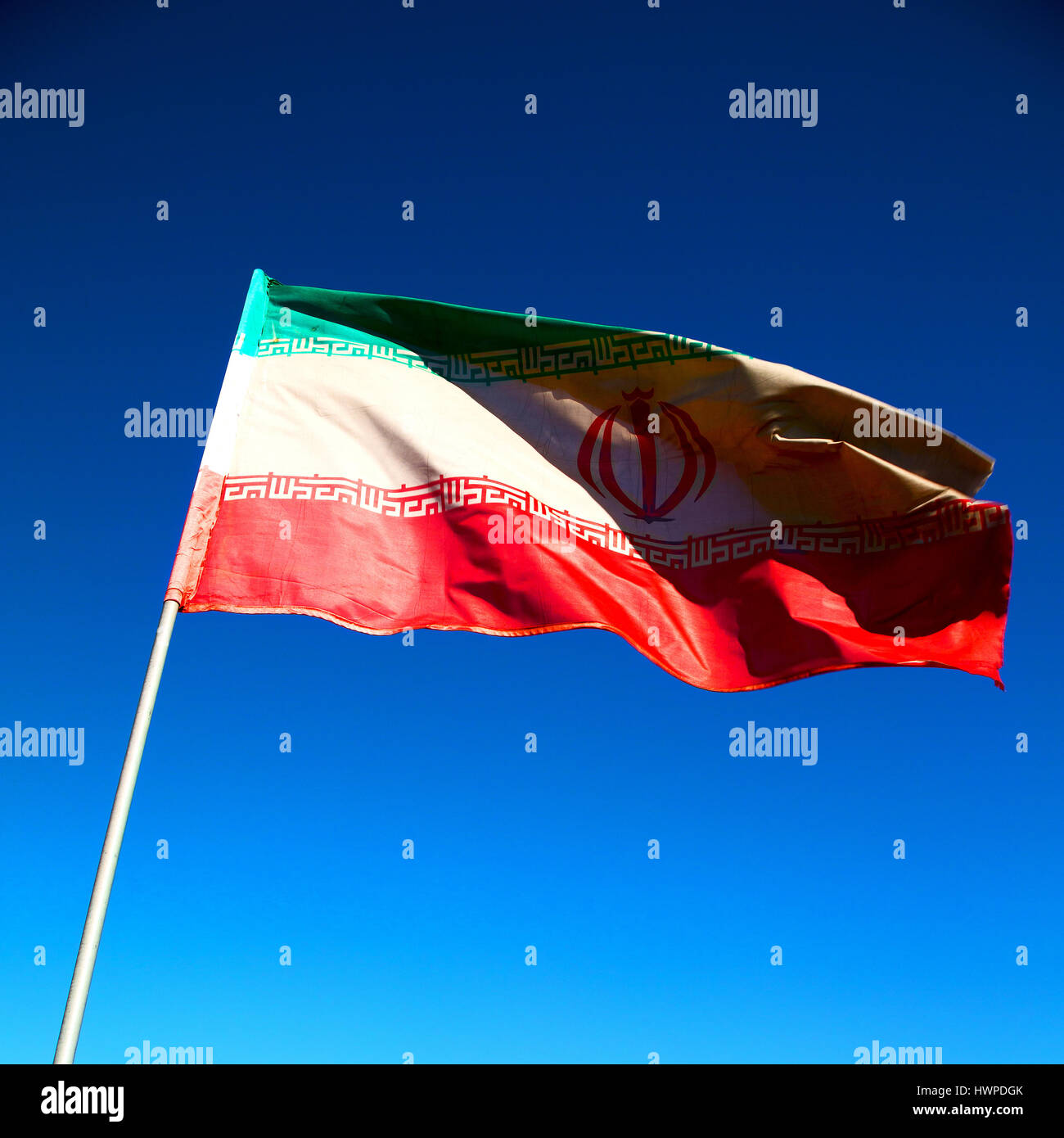 in iran blur iranian waving flag the blue sky and wind Stock Photo - Alamy