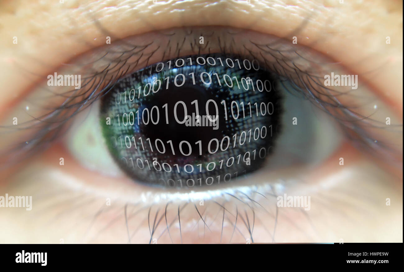close up digital eye watching code 0 1 screen Stock Photo - Alamy