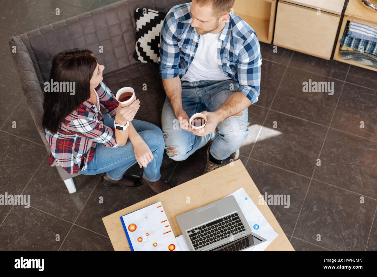 Top view of pleasant nice colleagues having tea Stock Photo - Alamy