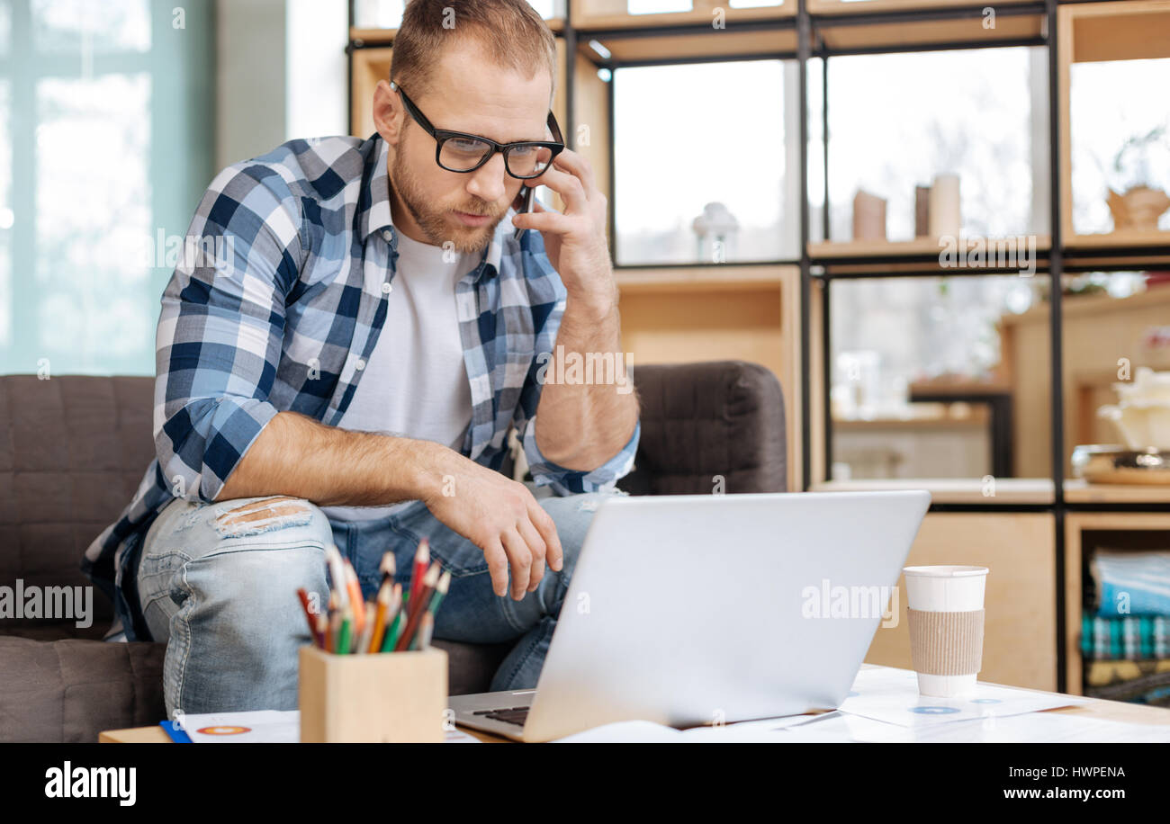 Serious handsome man making a call Stock Photo - Alamy Serious handsome man making a call Stock Photo - Alamy