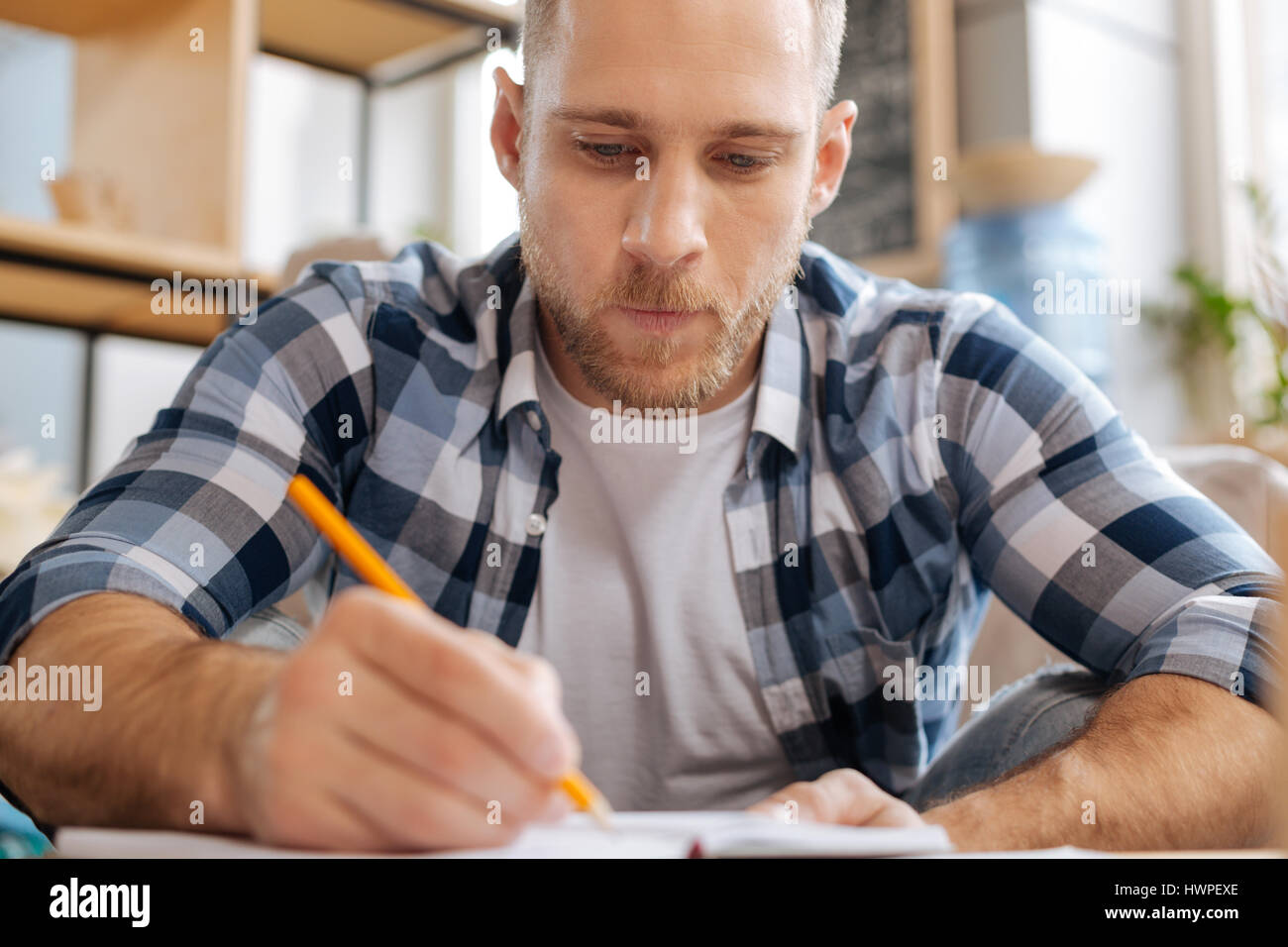 Serious focused man concentrating on his work Stock Photo - Alamy