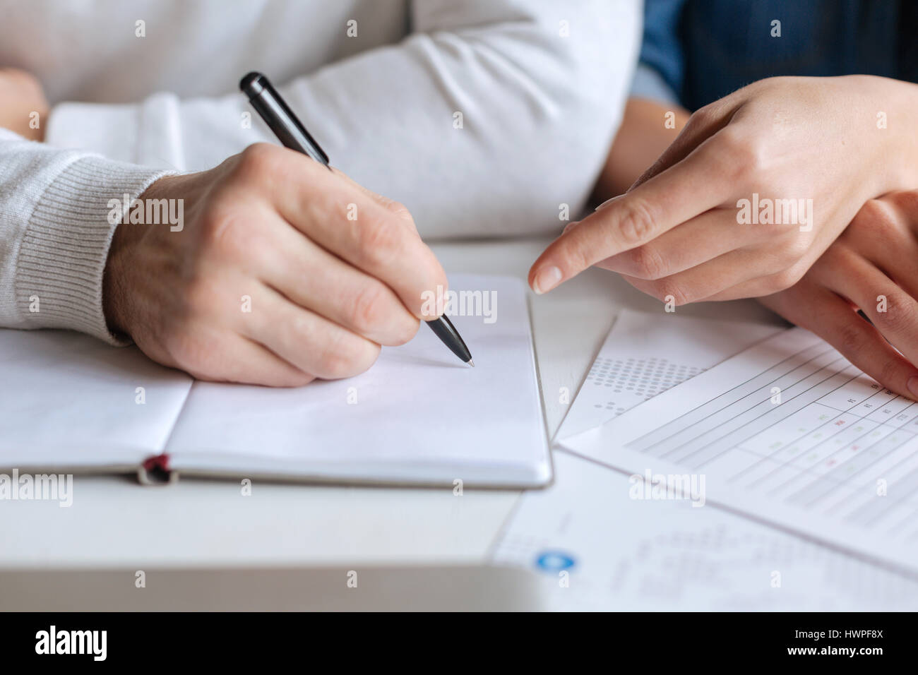 Close up of a pen being used for writing Stock Photo - Alamy