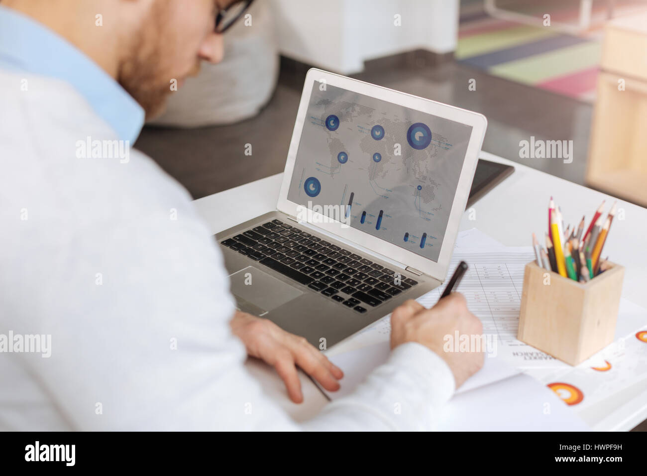 Hard working nice man focusing on his work Stock Photo - Alamy