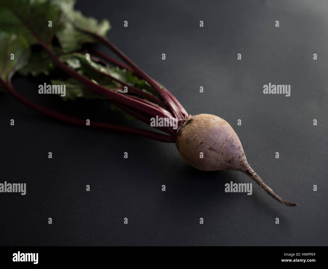 Organic beetroots with leaves isolated on black background Stock Photo ...