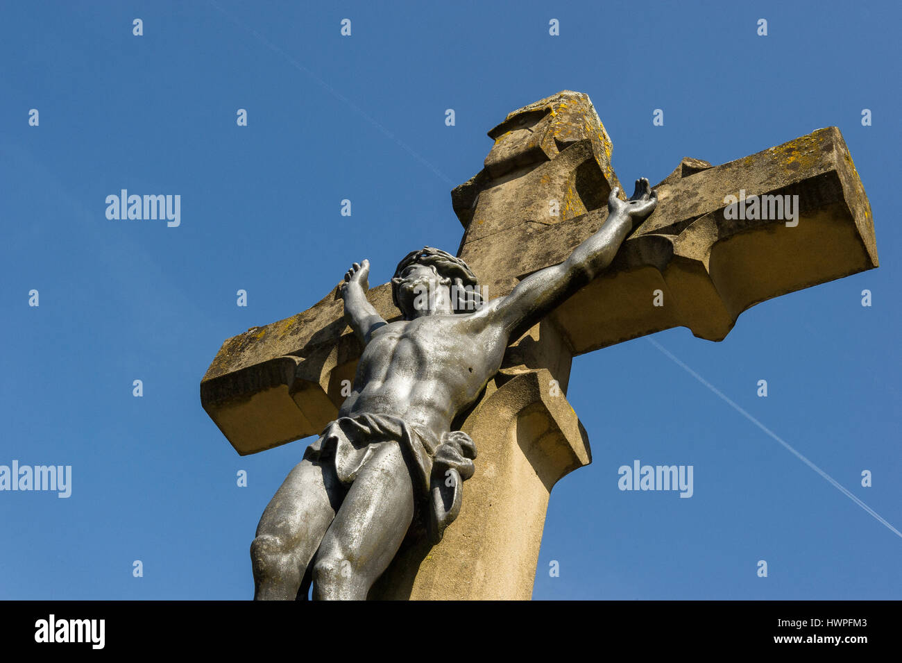 christian stone cross with jesus Stock Photo - Alamy