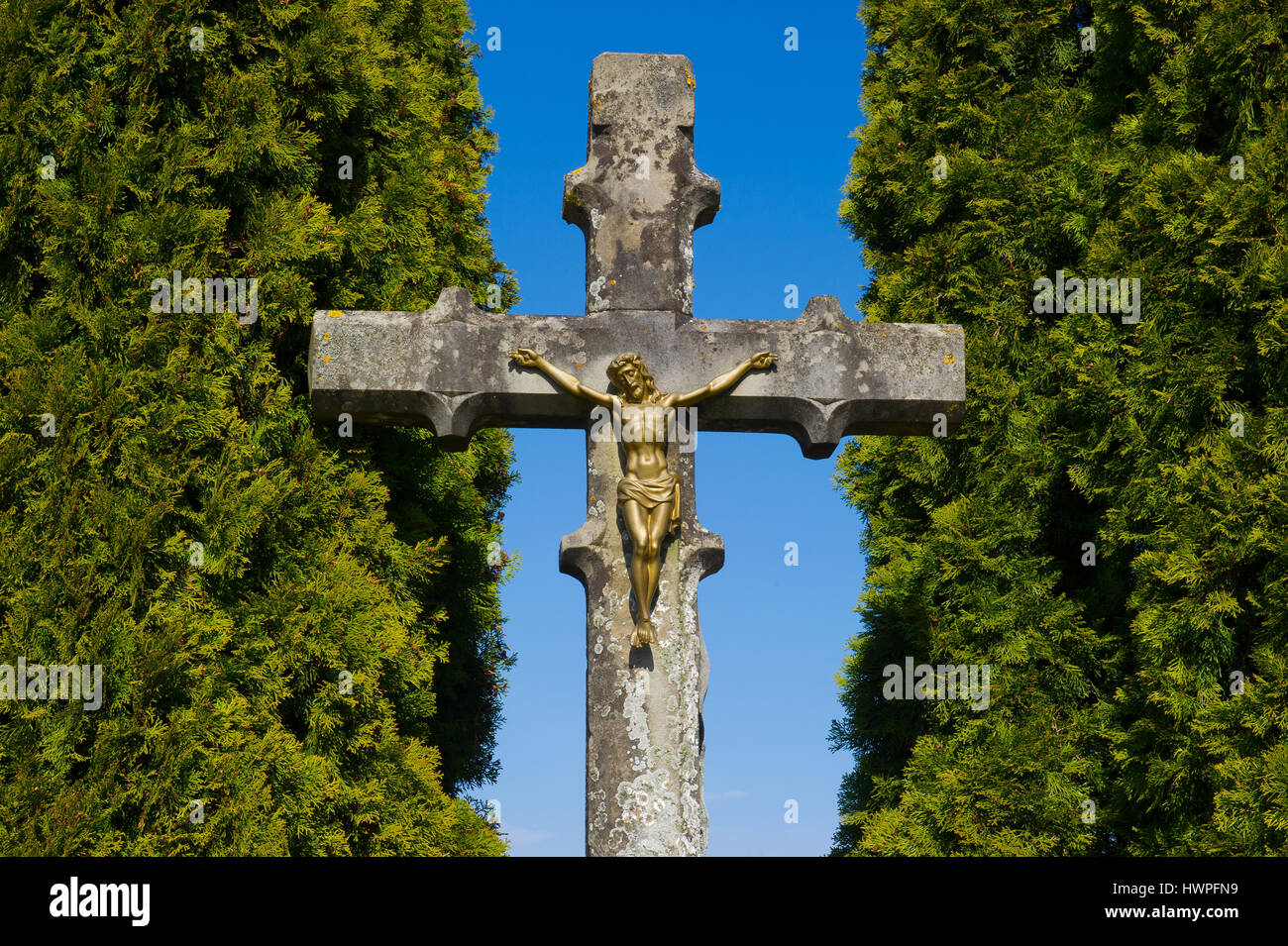 christian stone cross with jesus Stock Photo - Alamy