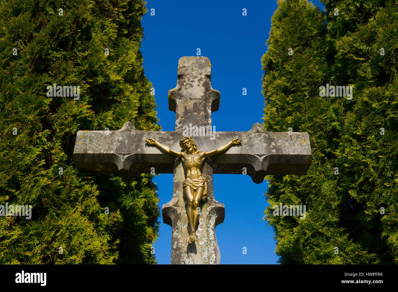 christian stone cross with jesus Stock Photo - Alamy