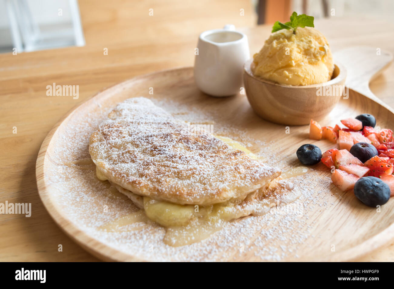 closeup fresh homemade dessert soft vanila roti with cool ice cream ...