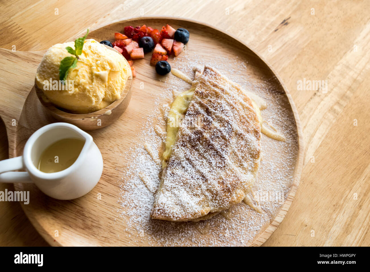 closeup fresh homemade dessert soft vanila roti with cool ice cream ...