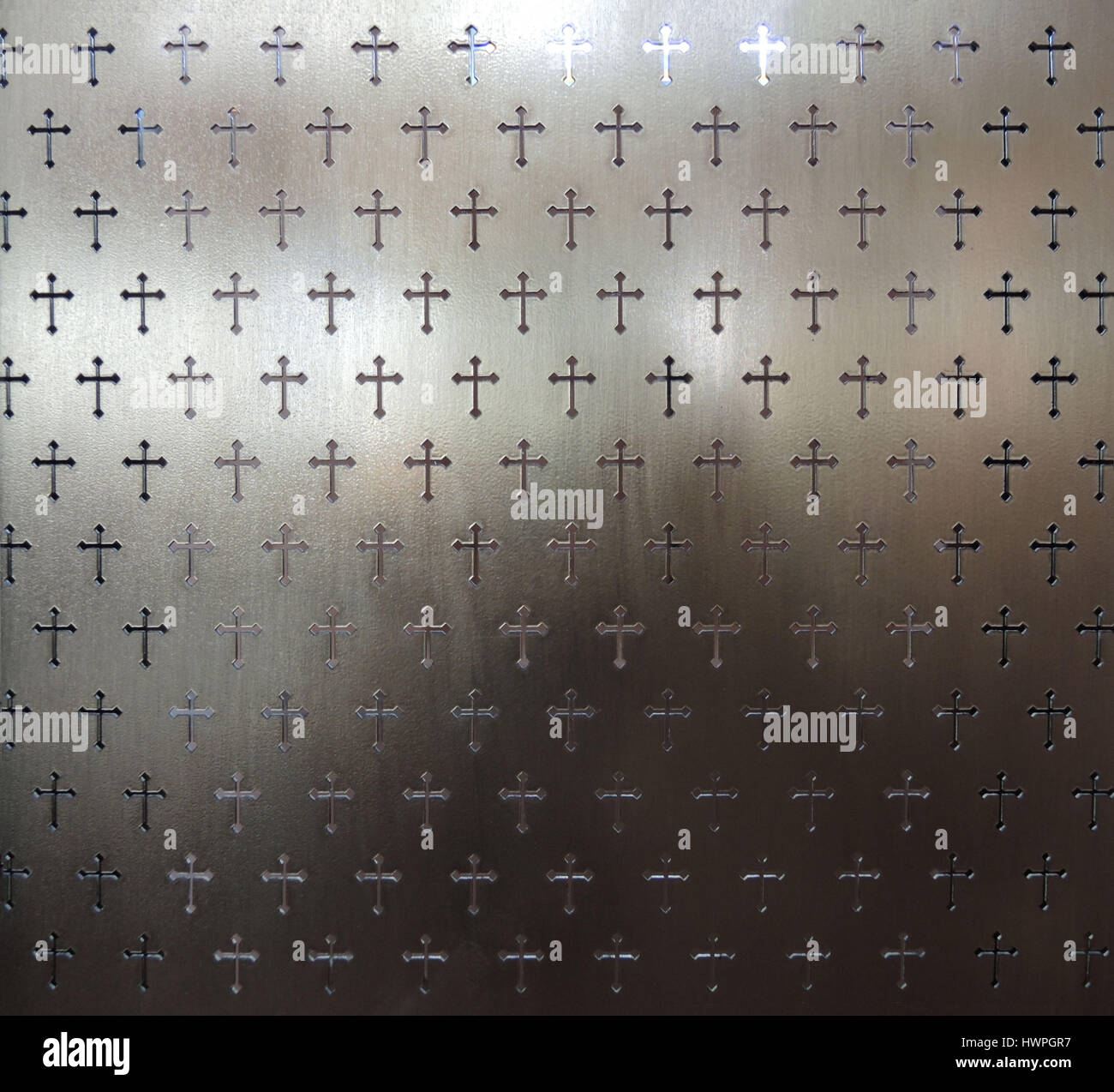 Christian cross pattern on the mirror background of confessional box at ...