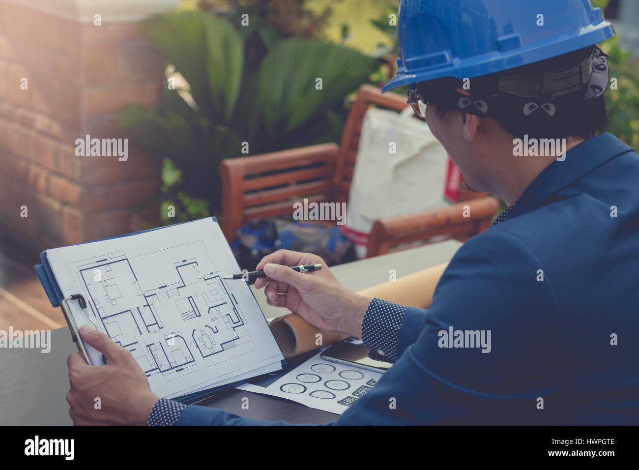 professional business engineer holding architecture blueprint project ...