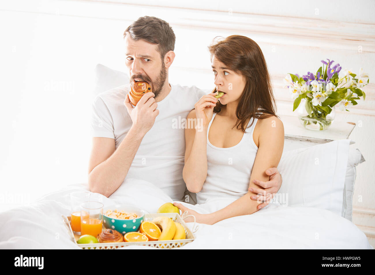 Relaxed Couple in Bed in bedroom at home Stock Photo - Alamy
