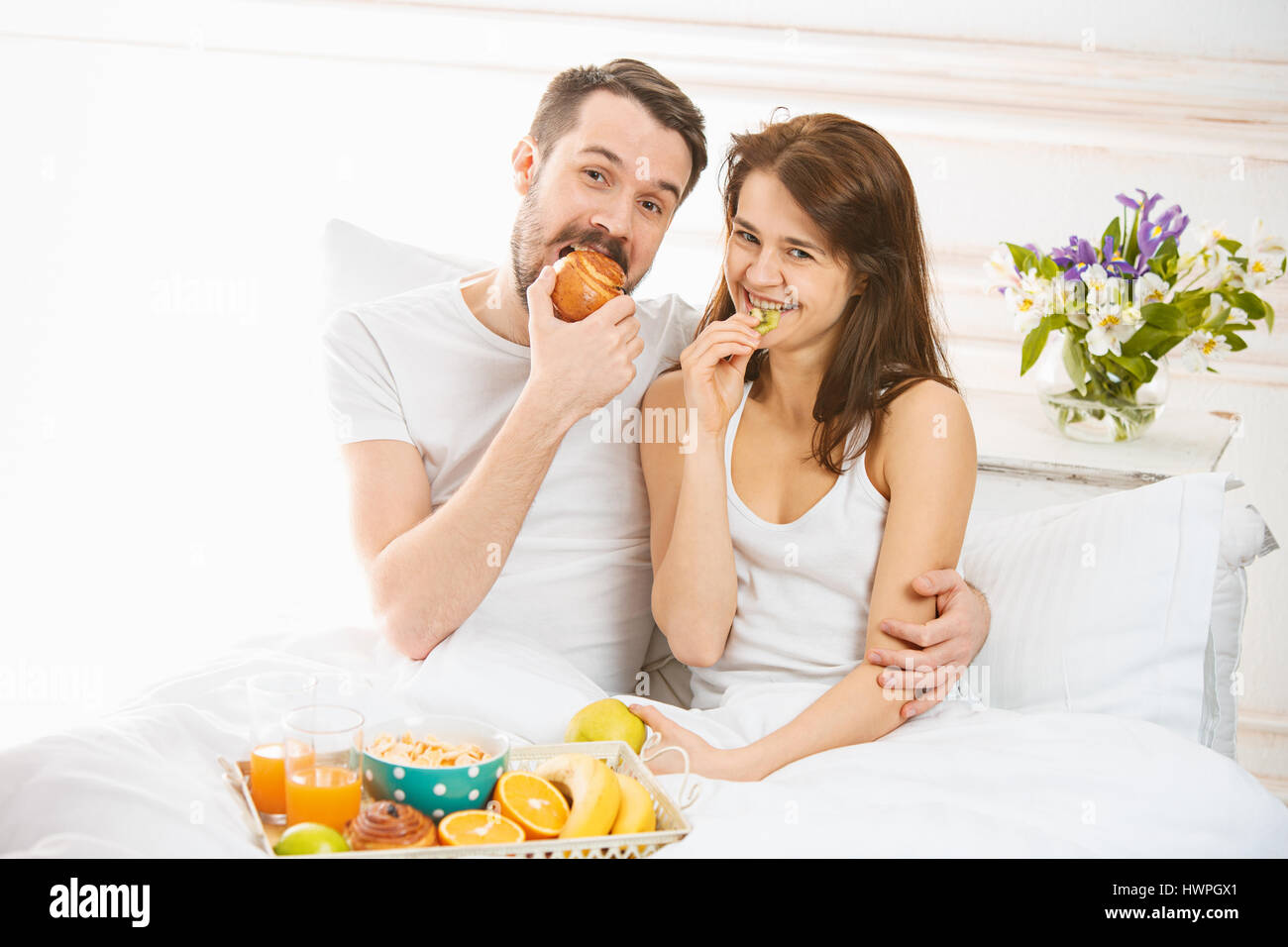 Relaxed Couple in Bed in bedroom at home Stock Photo - Alamy