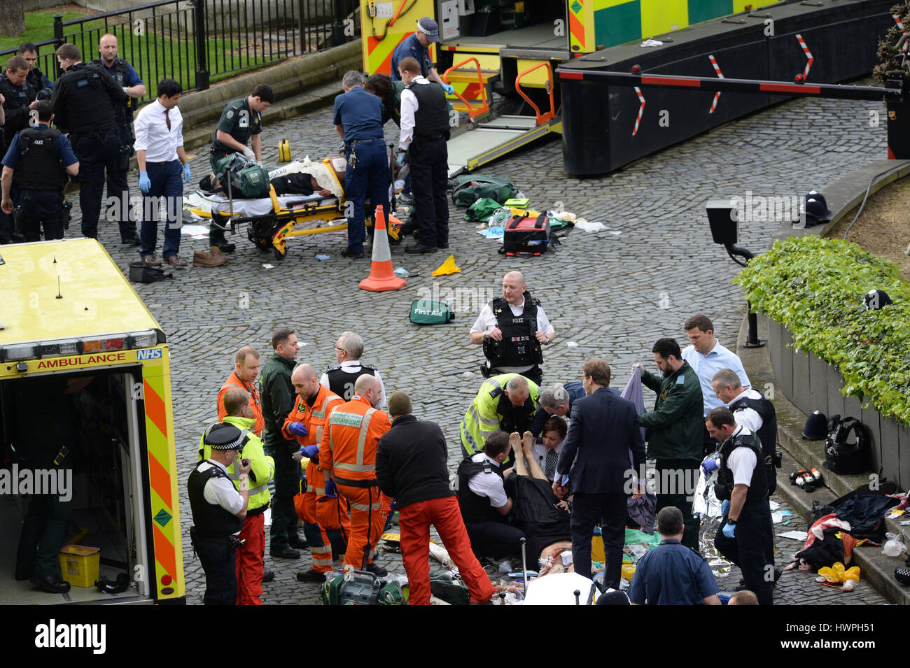 Stands amongst emergency services scene outside palace westminster hi ...