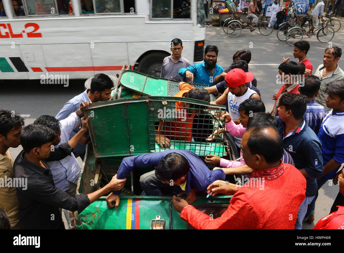Dhaka 19 march 2017. Onlookers rescue the driver and passengers of a ...