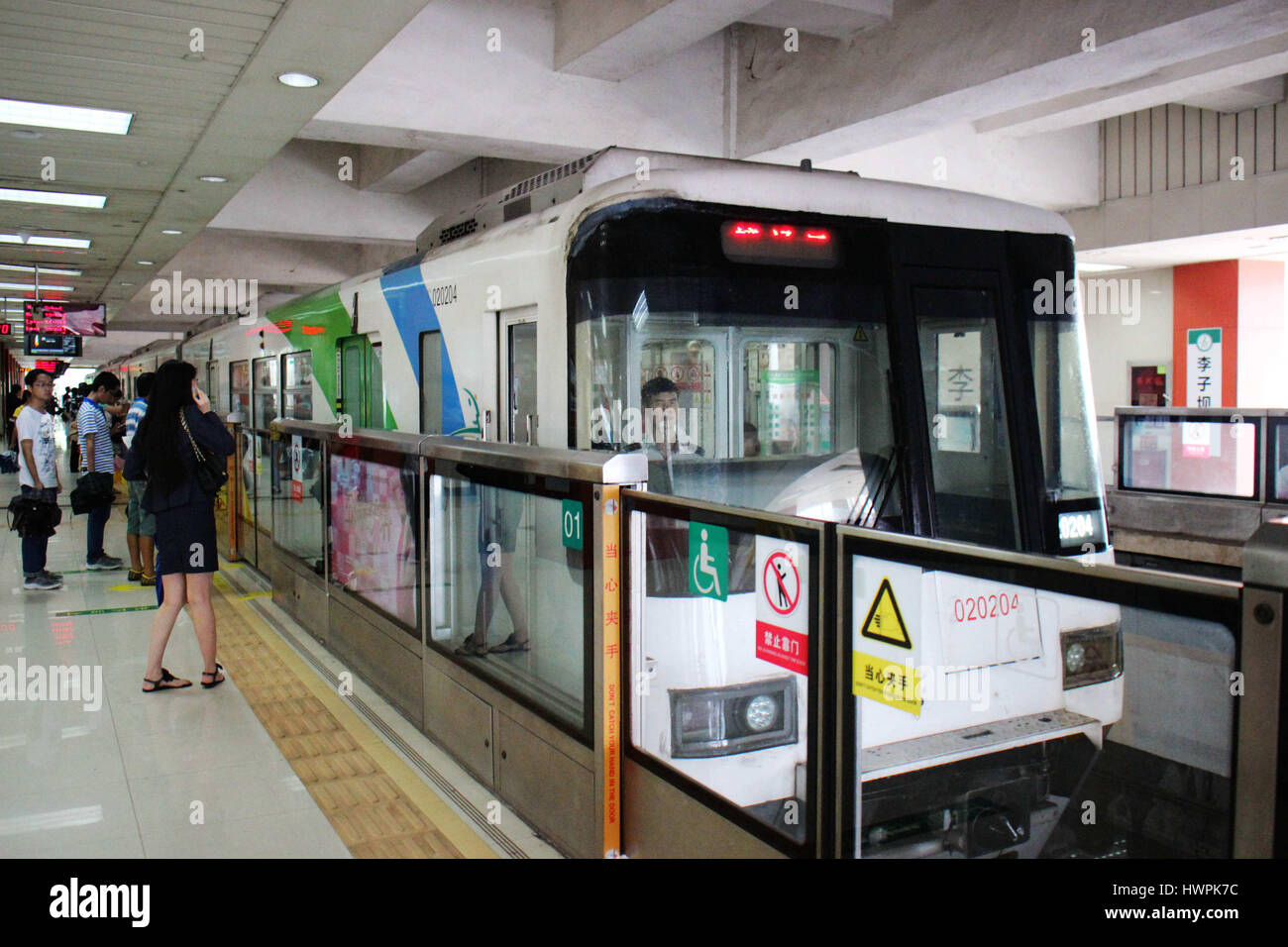 Chongqing, China. 22nd Mar, 2017. The light rail passes through a ...