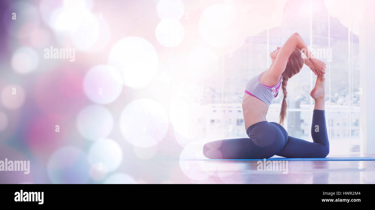 Full length side view of a fit young woman stretching body in exercise ...