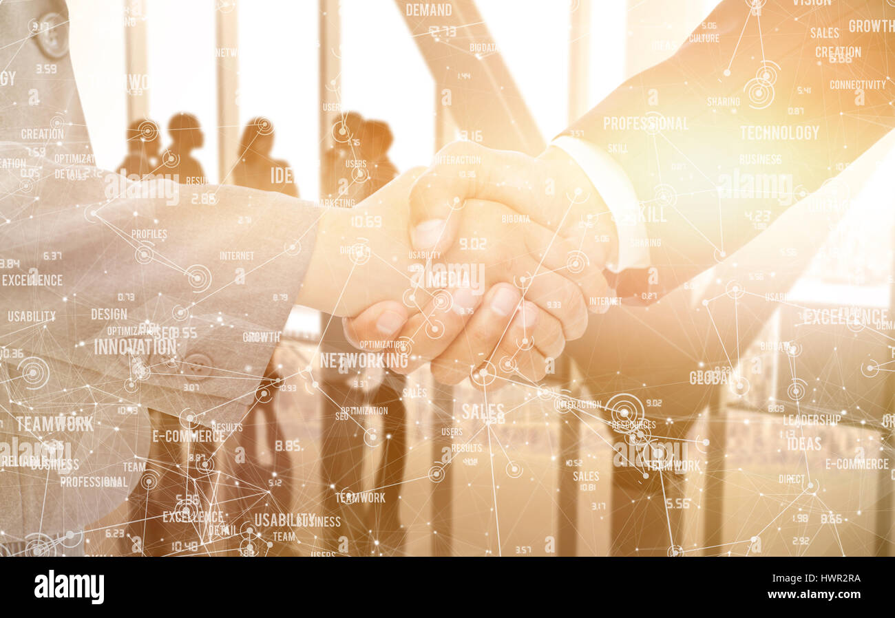 Handshake between two business people against composite image of sphere ...
