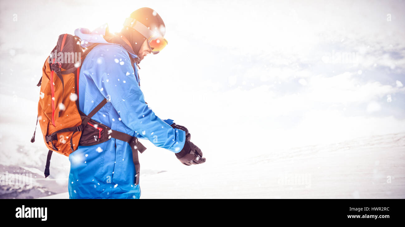 Skier wearing hand gloves while getting ready for skiing Stock Photo ...