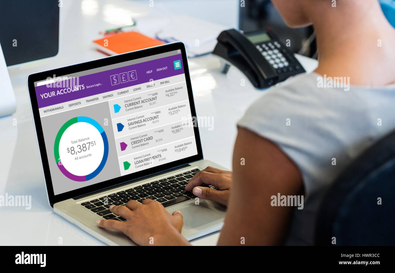 Graphic image of bank account web site against woman working on laptop ...
