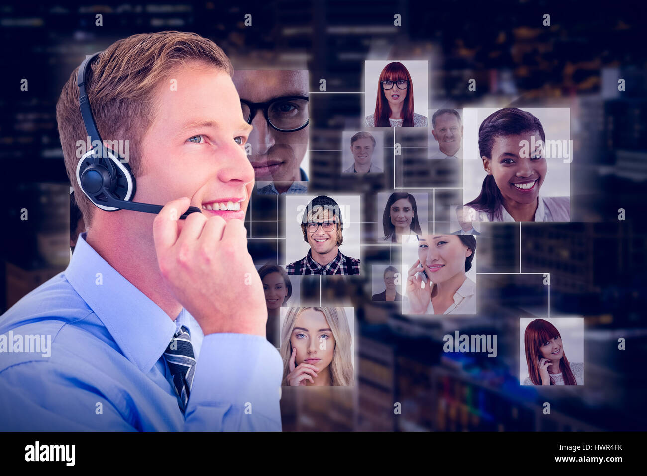 Handsome agent with headset against illuminated building in city at ...