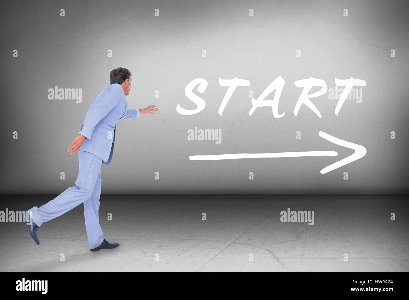 Businessman running on white background against grey room Stock Photo ...