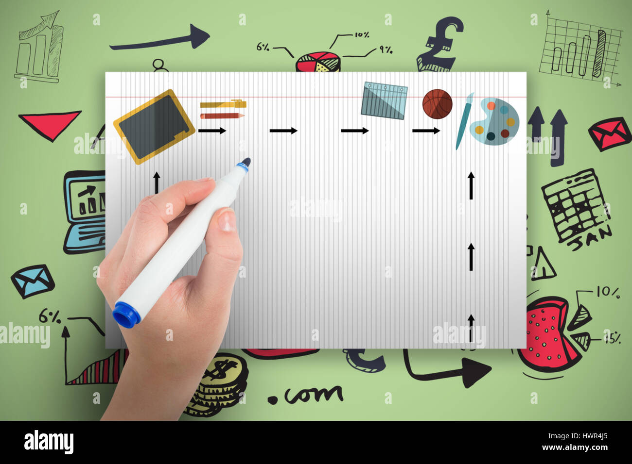 Hand holding black crayon against green background Stock Photo - Alamy