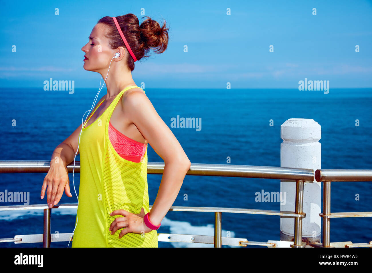 Look Good, Feel great! Relaxed young healthy woman in fitness outfit ...