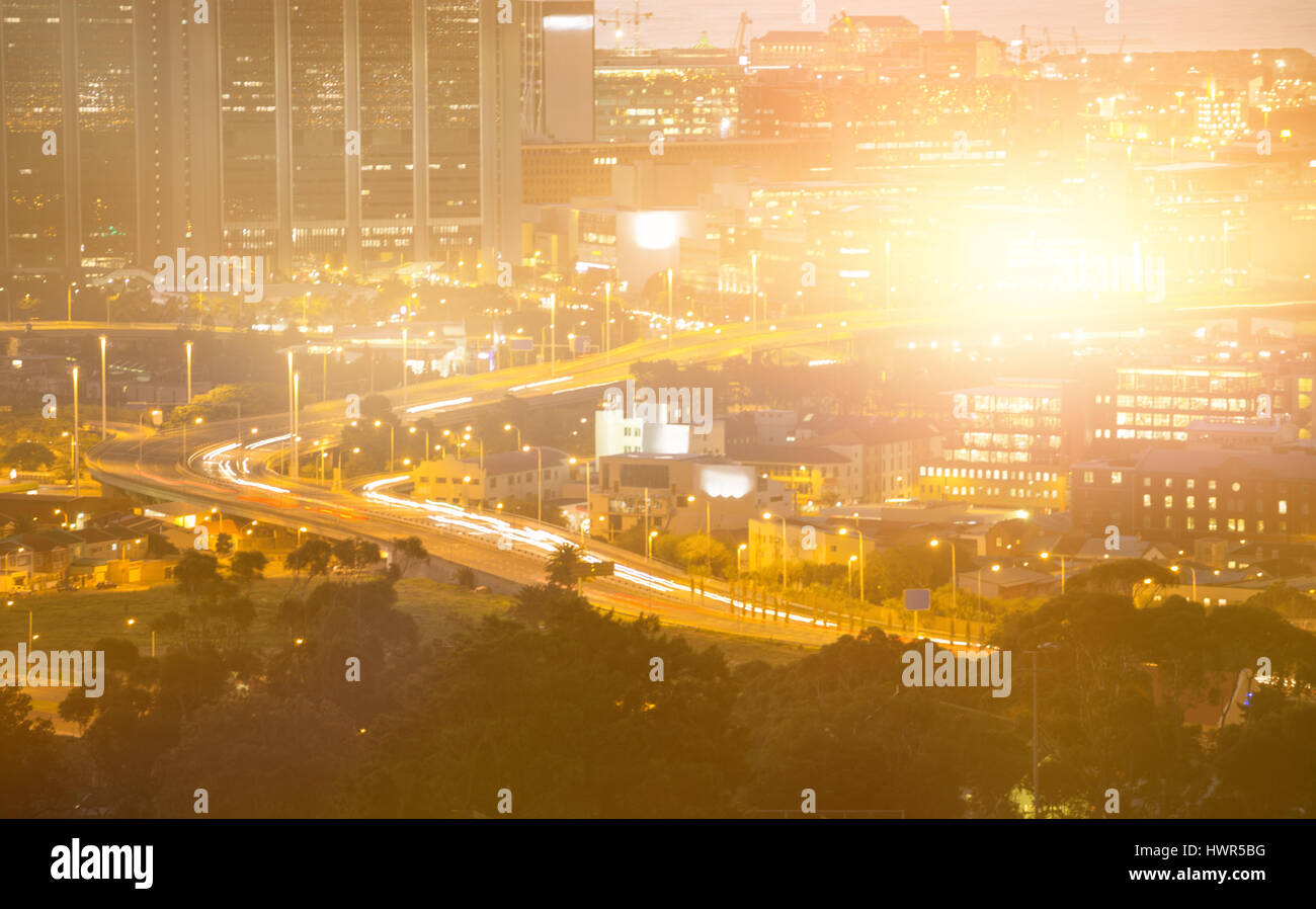 Blurry animated flare against illuminated cityscape Stock Photo - Alamy