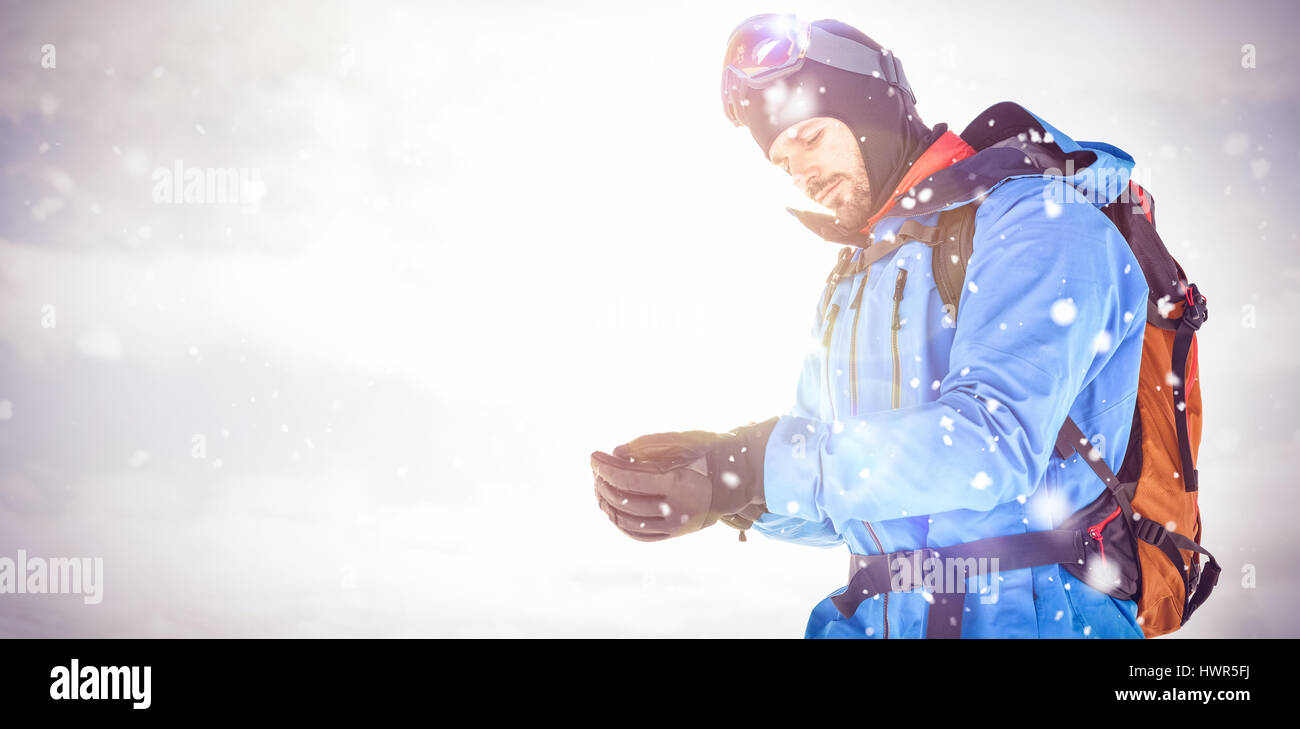 Skier wearing hand gloves while getting ready for skiing Stock Photo ...