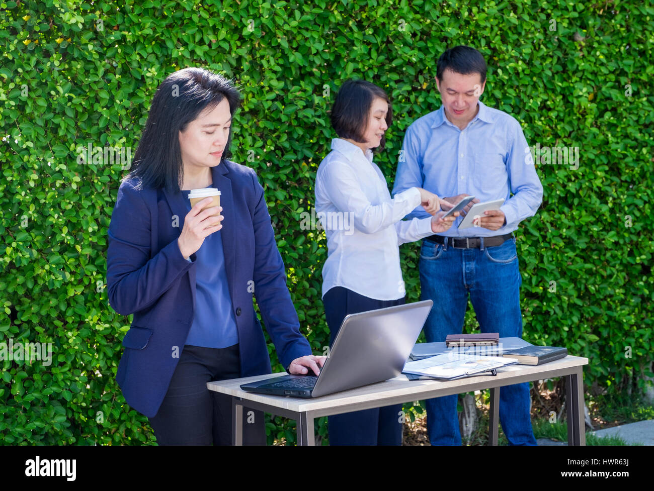 People Working Together As A Team Outside