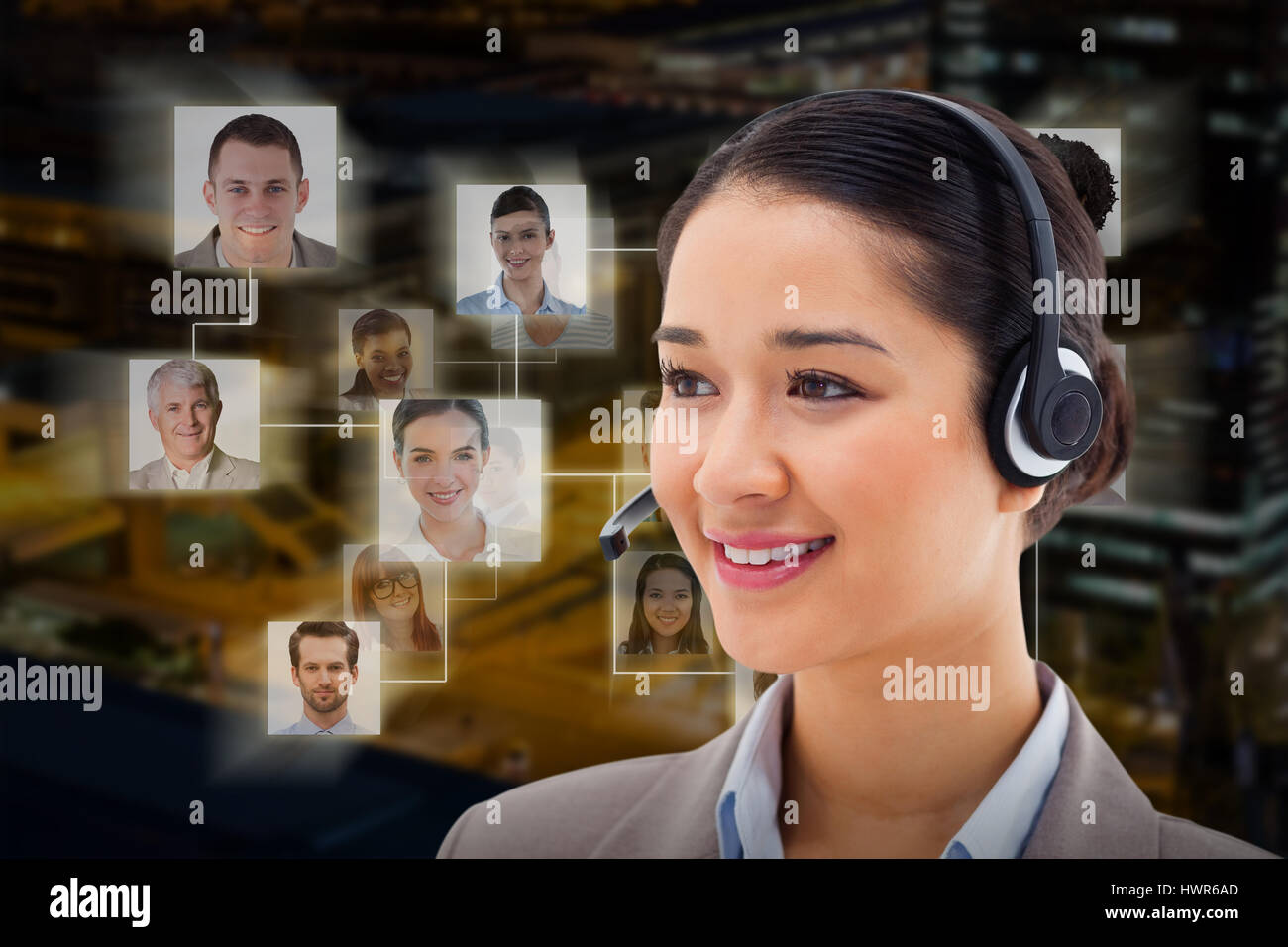 Happy operator posing with a headset against illuminated road in city ...