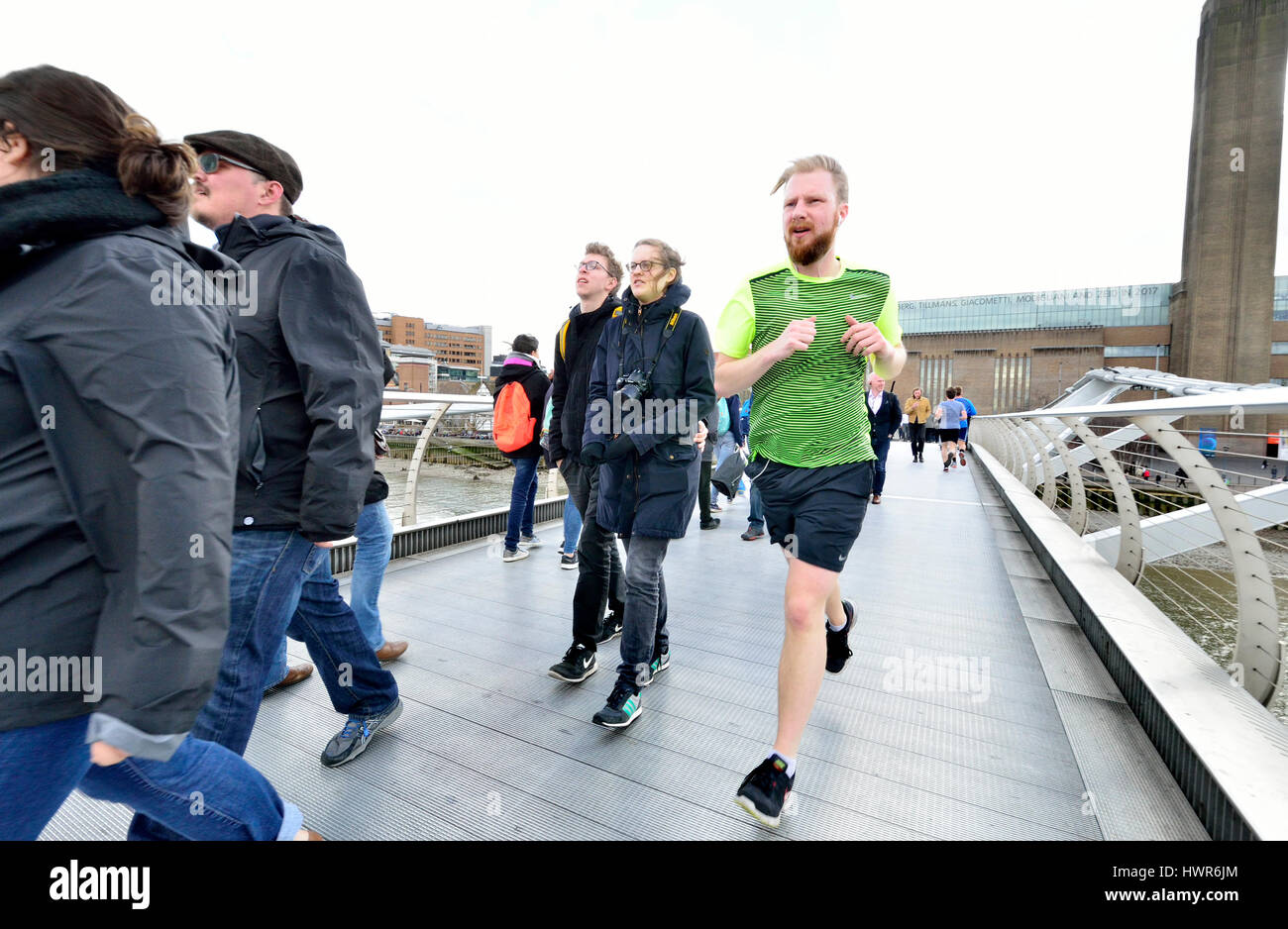 London, England, UK. Runners on the Millennium Bridge, running from ...