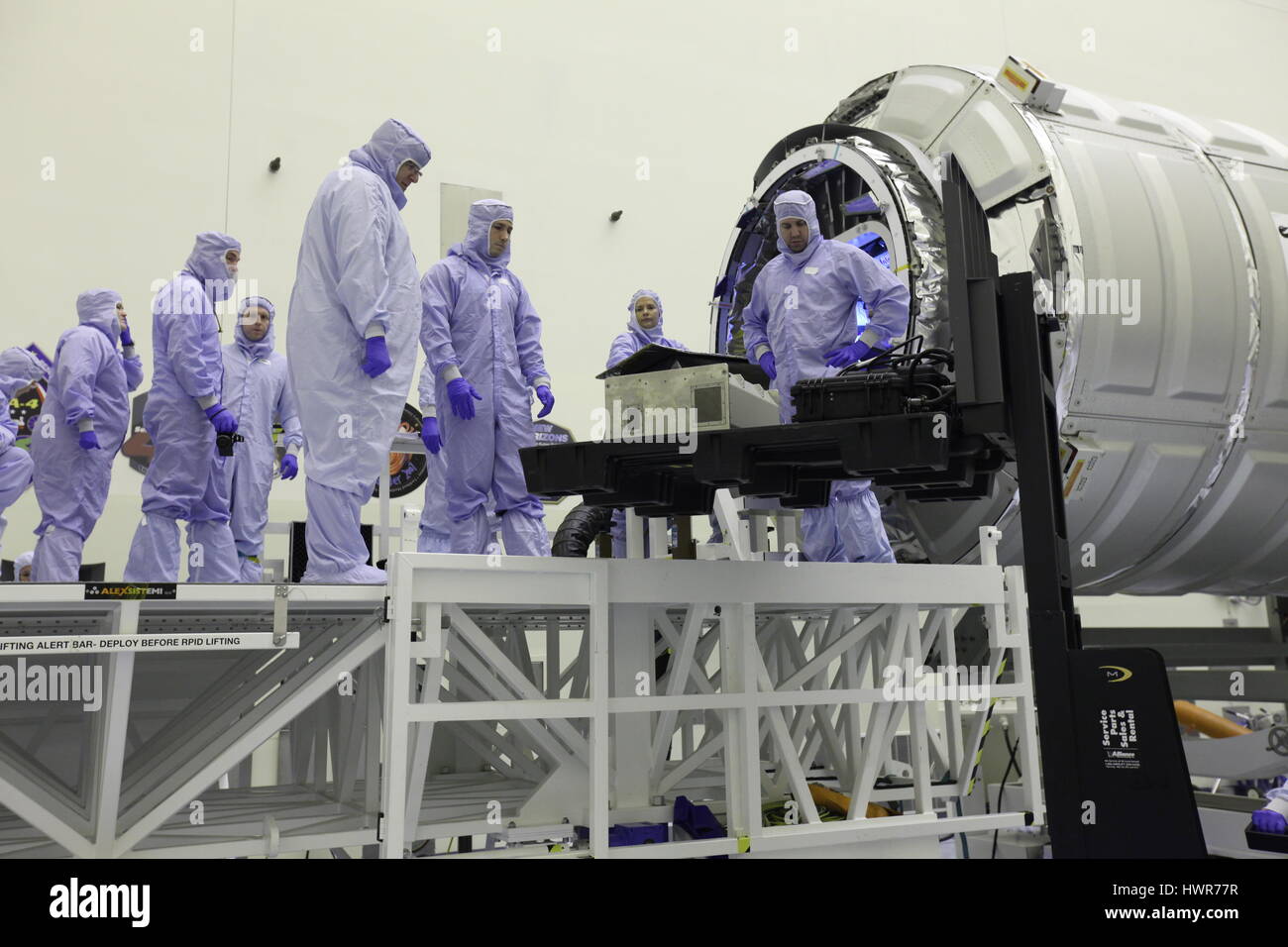 Nasa Technicians Load A Powered Cargo Unit Into The Orbital Atk Cygnus