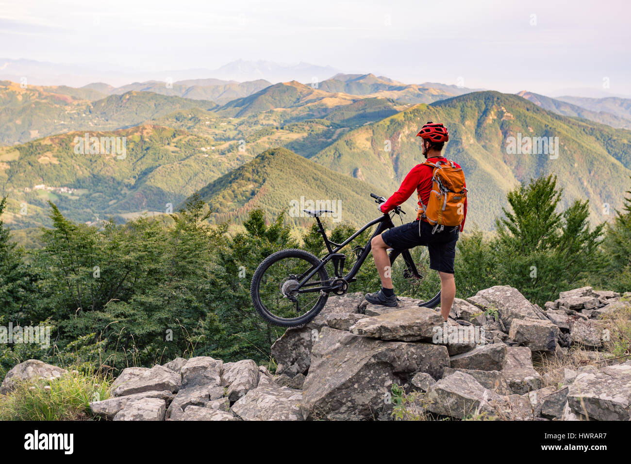 Mountain biker looking at beautiful inspirational landscape view on ...