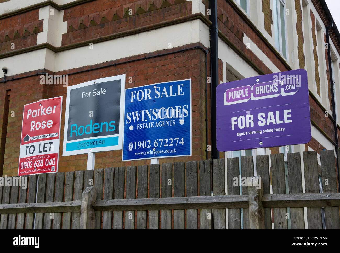 For Sale and To Let property signs attached to fence Stock Photo - Alamy