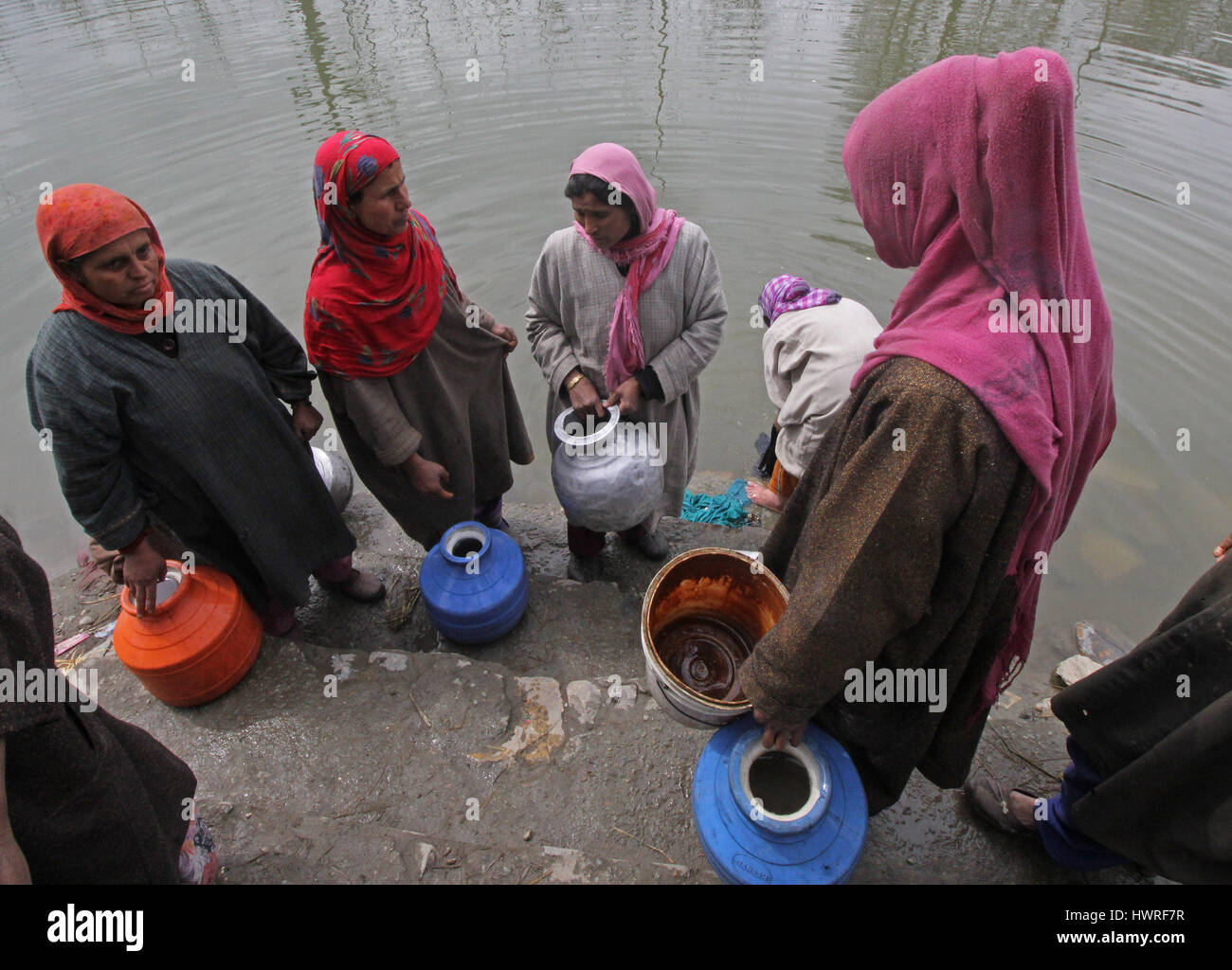Indian women fetch water hi-res stock photography and images - Alamy