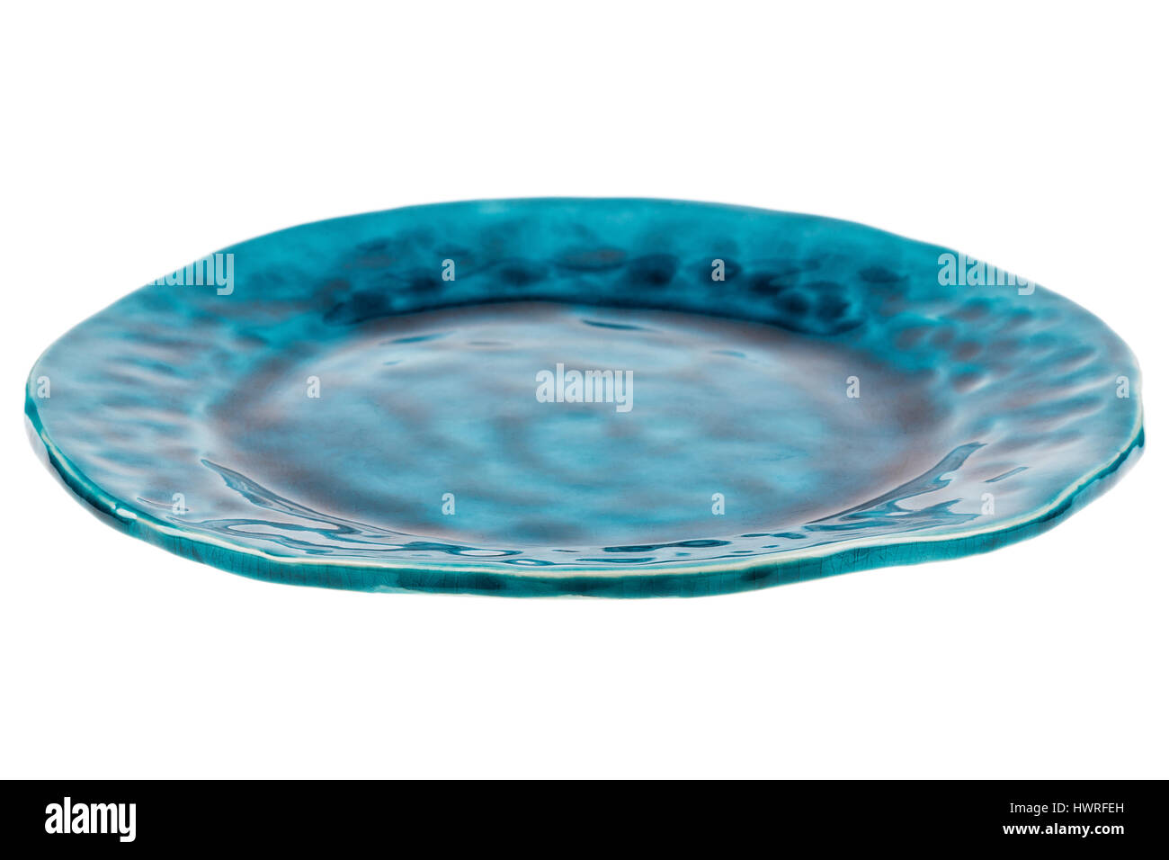 Blue handmade pottery plate isolated on white background Stock Photo ...