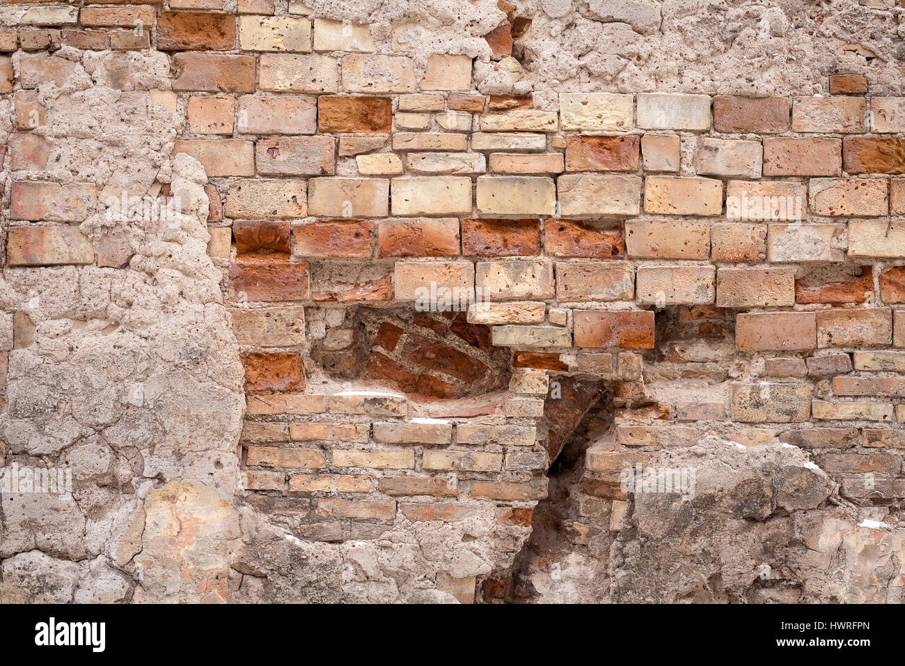 Detail of an old cracked brick wall texture Stock Photo - Alamy