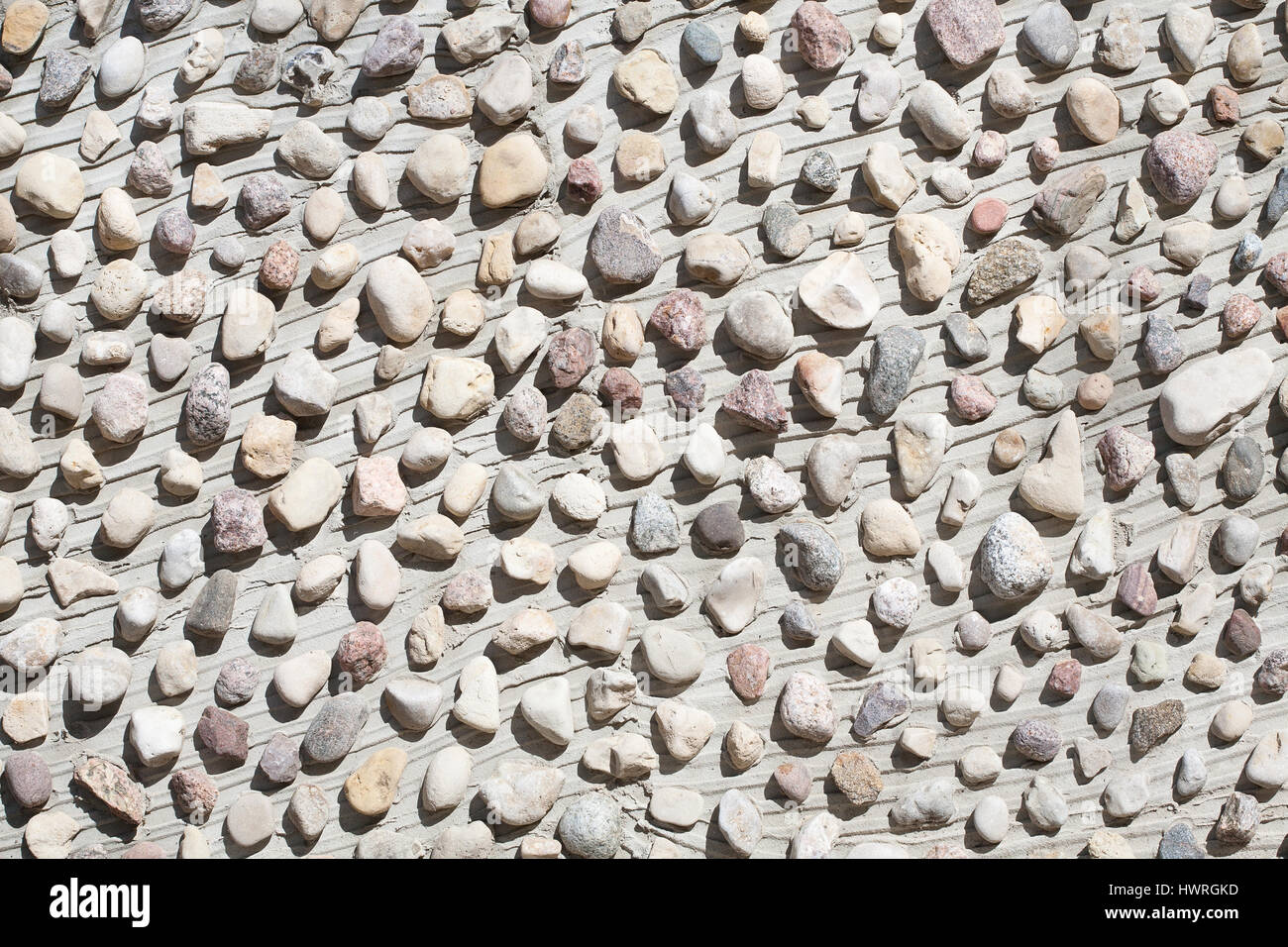 Wall of mixed materials - stones and concrete Stock Photo - Alamy