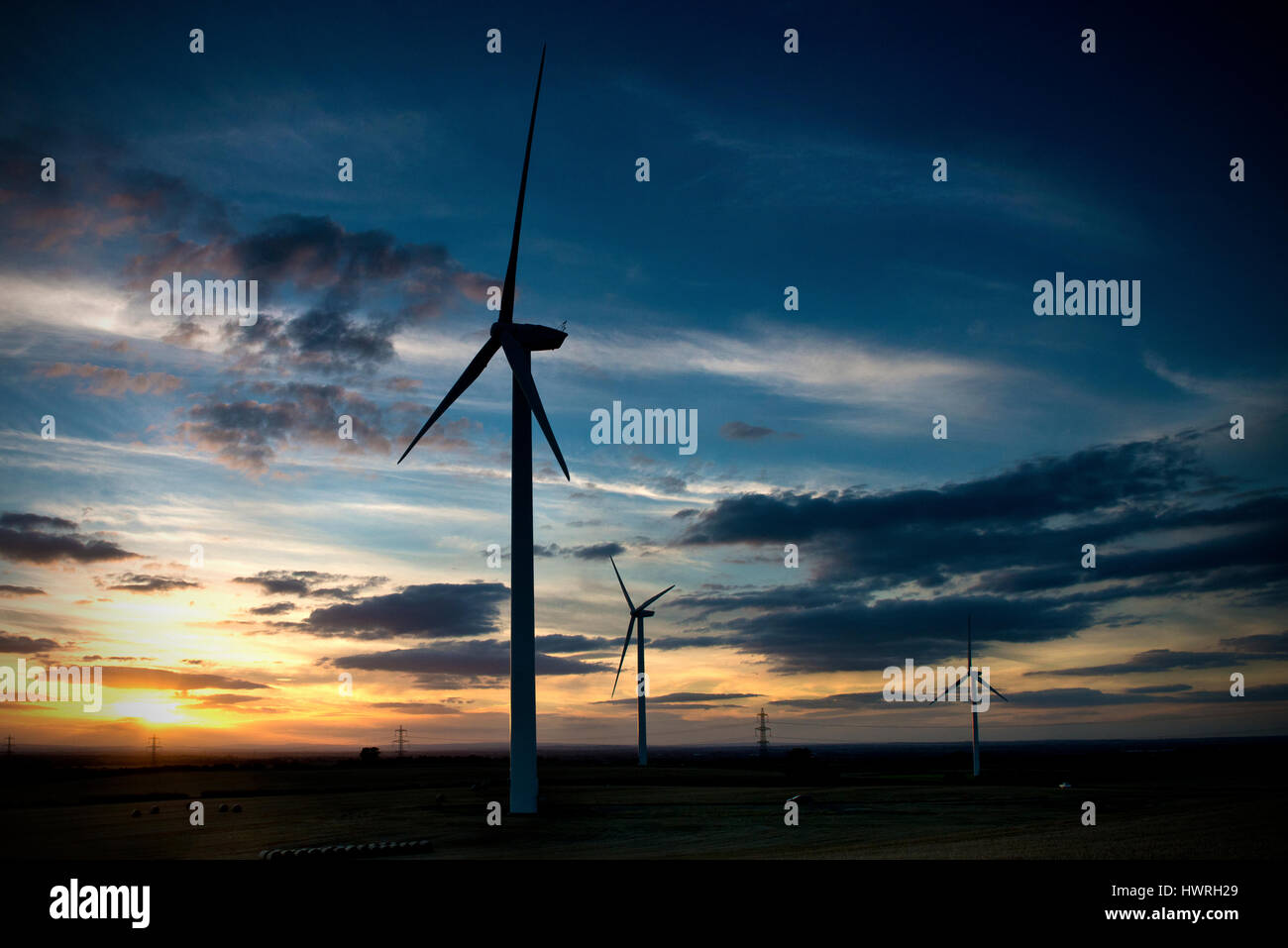 Wind turbines at sunset Stock Photo - Alamy