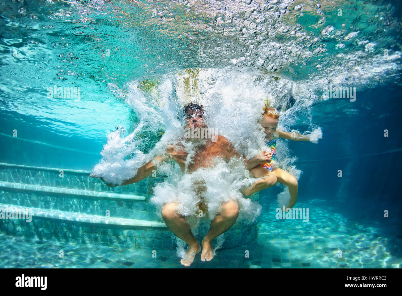Group dive jump into pool hi-res stock photography and images - Alamy
