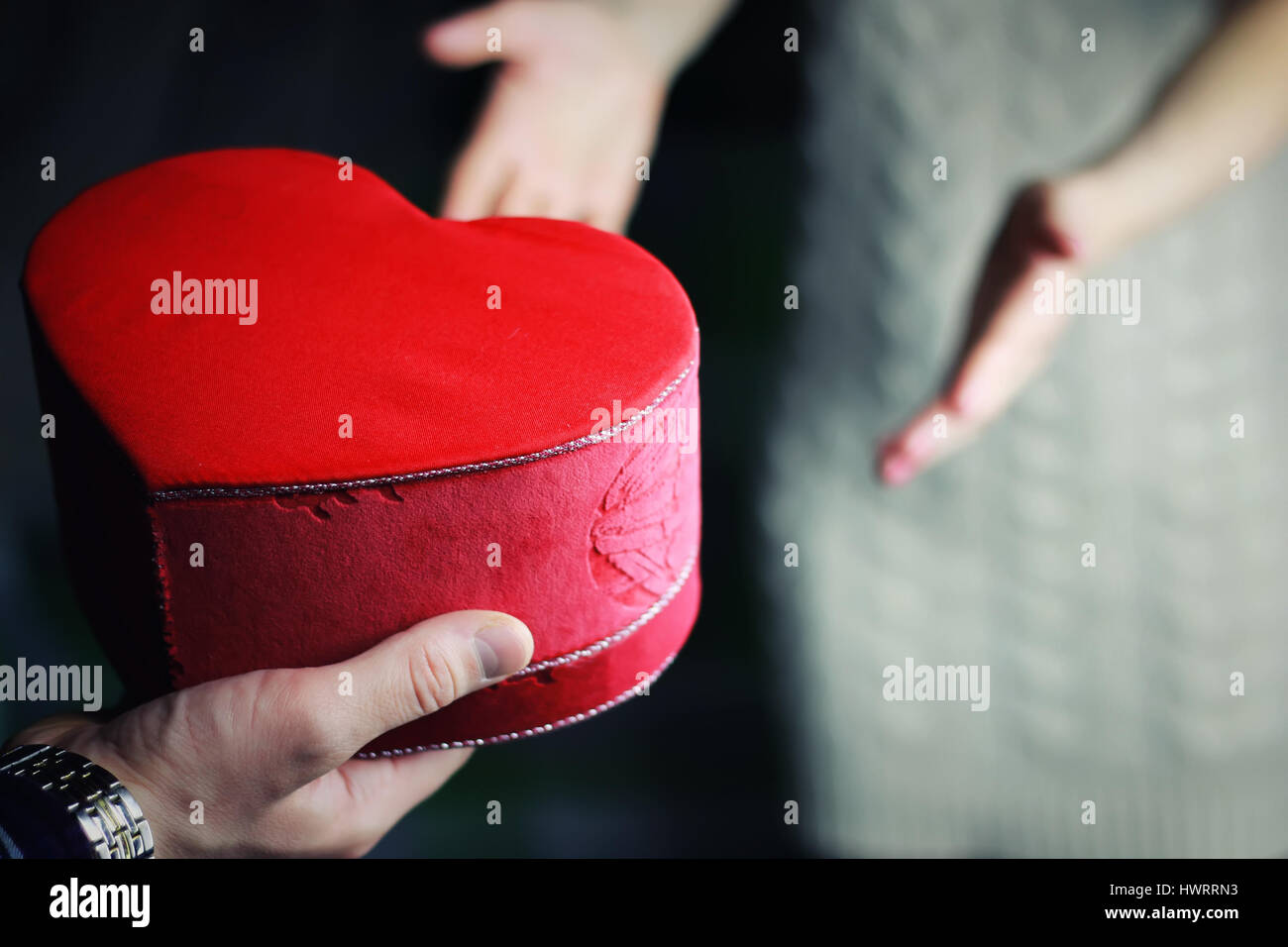 man hand give valentine heart couple Stock Photo - Alamy