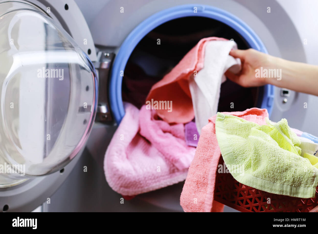 put cloth in washer Stock Photo - Alamy